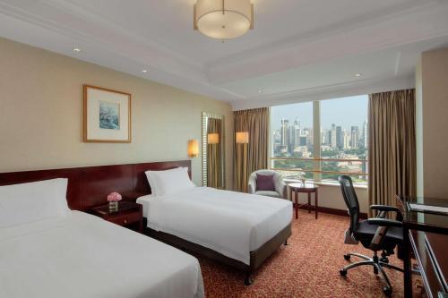 Radisson Blu Hotel Shanghai New World, Shanghai - Central de Reservas